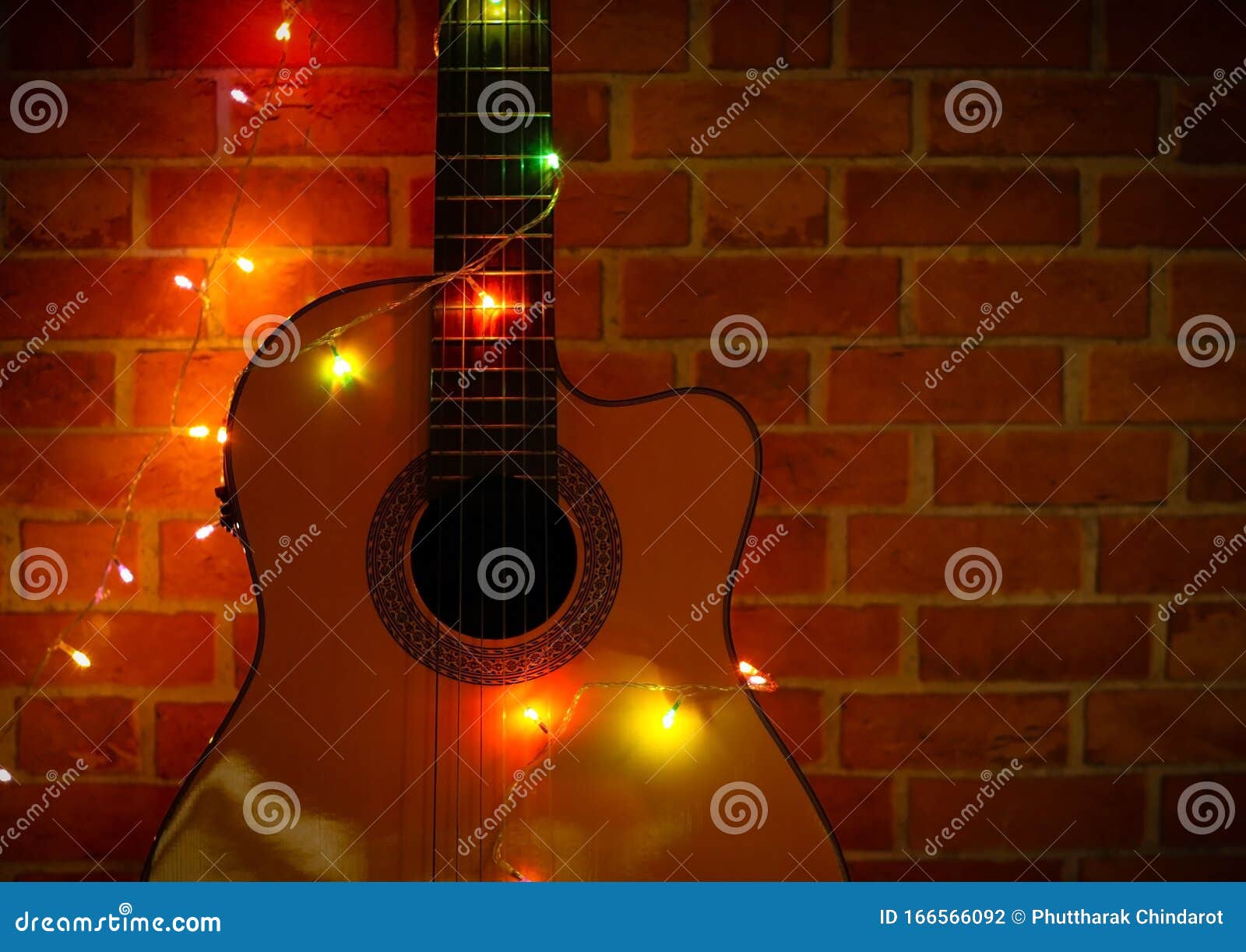 Classical Guitar with Glowing Christmas String Light Stock Photo ...