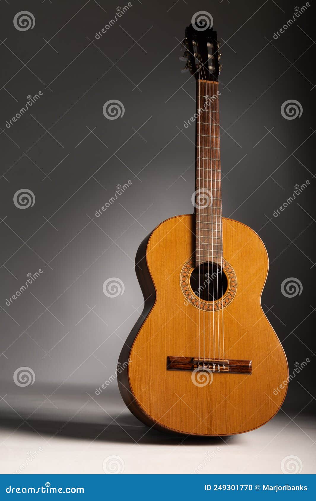 Classical Guitar on a Grey Background with Copy Space Stock Photo ...