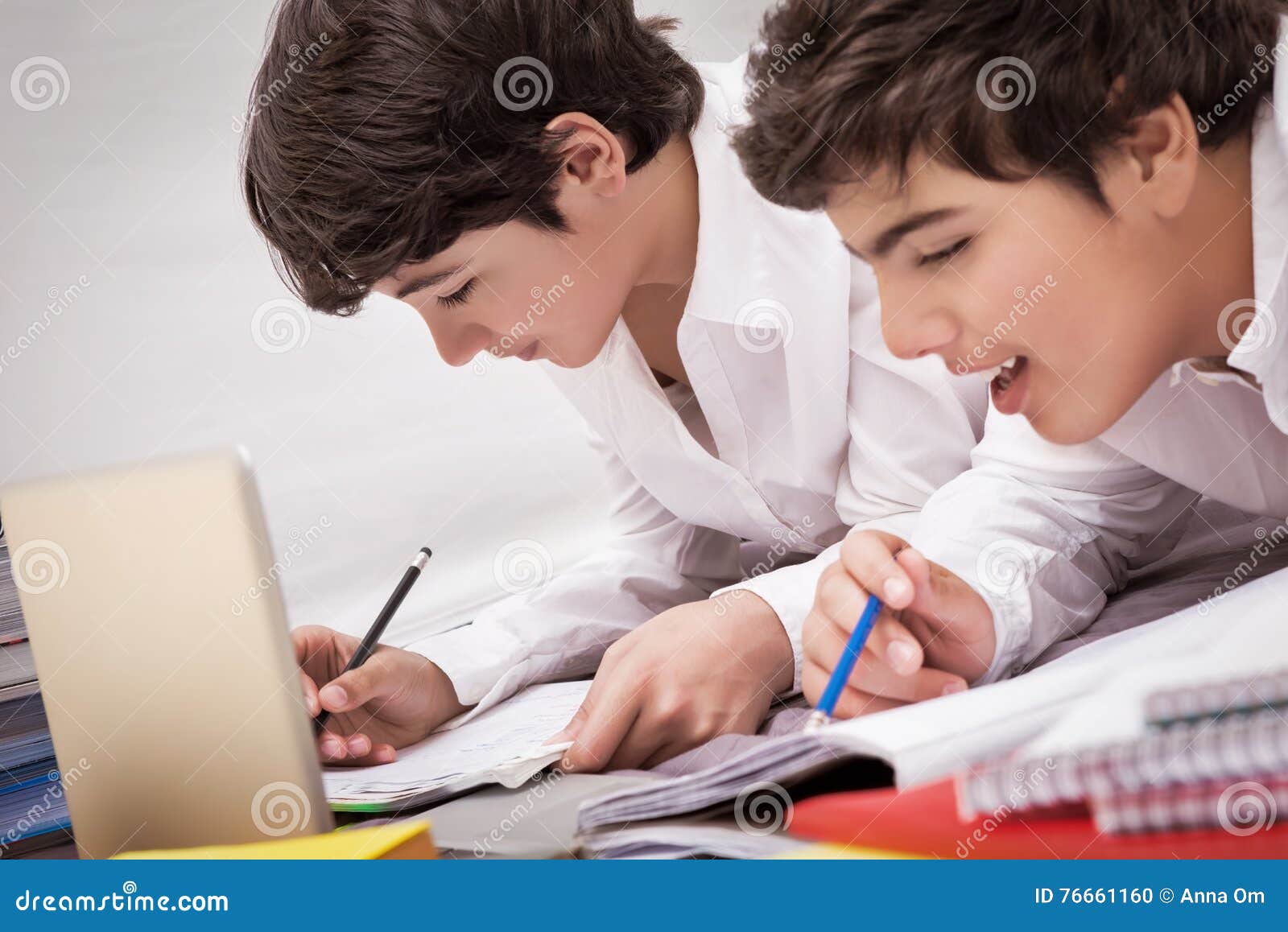 Classmates doing homework stock photo. Image of hometask - 76661160
