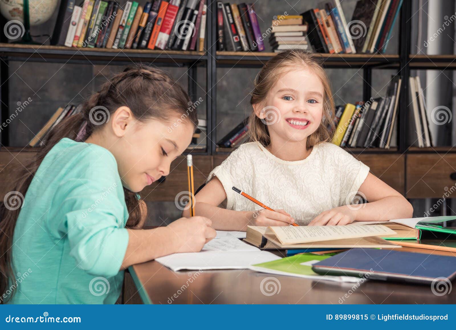Classmates Doing Homework Together in Library Stock Image - Image of ...