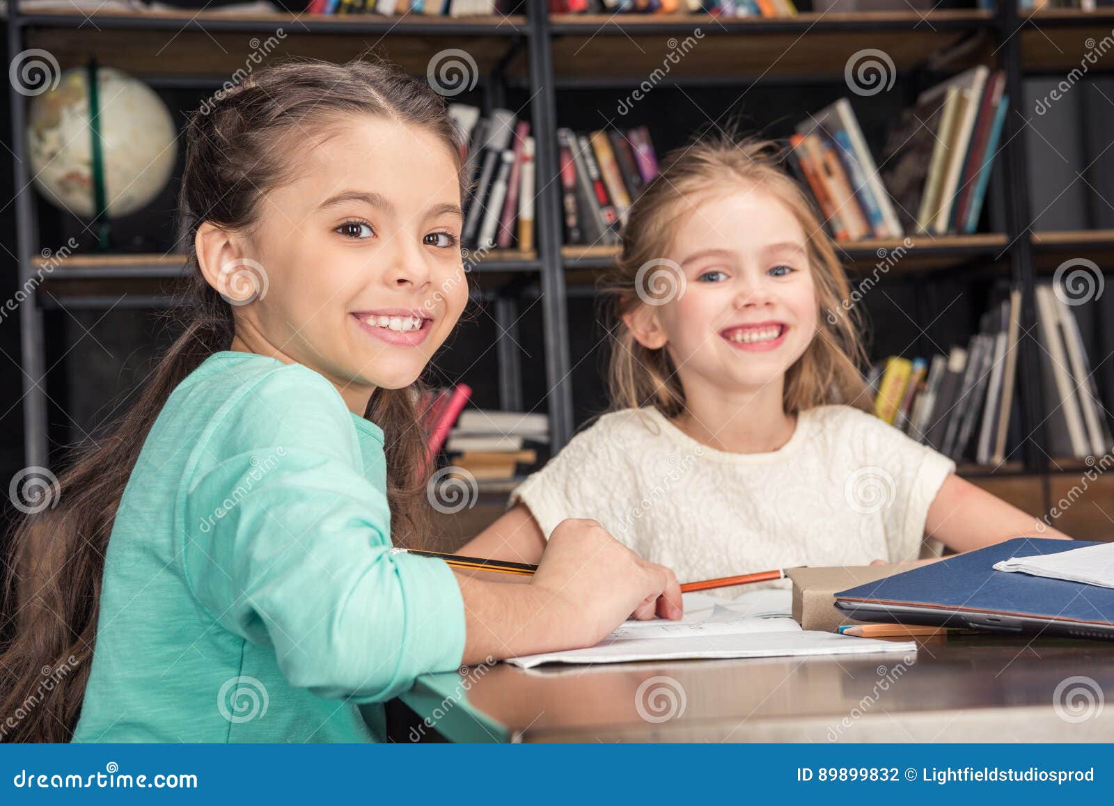 Classmates Doing Homework Together in Library Stock Photo - Image of ...