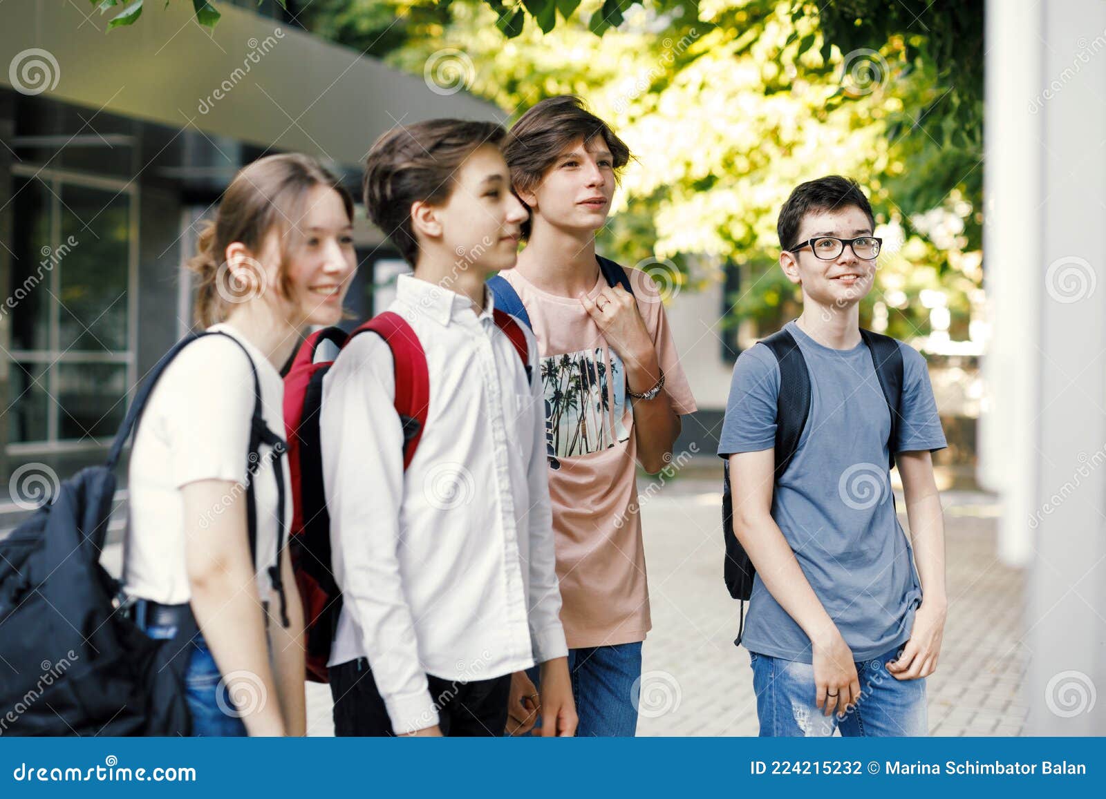 Classmates Looking at the Timetable in the School Yard Stock Photo ...