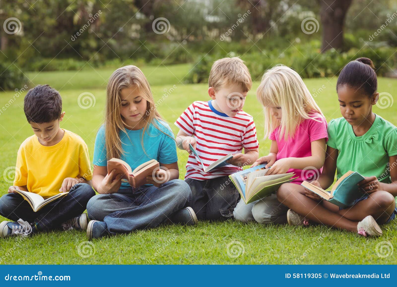 Classmates Sitting in Grass and Reading Books Stock Image - Image of ...