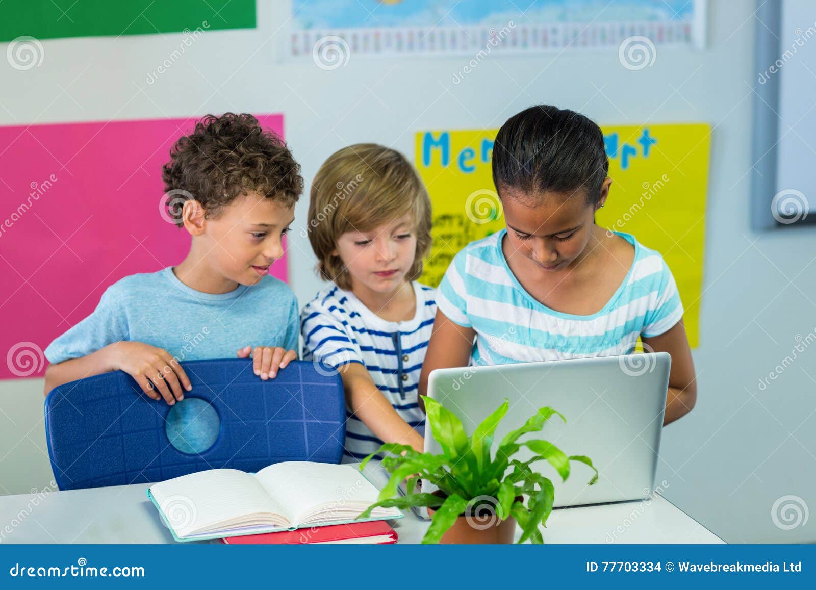 Classmates using laptop stock photo. Image of education - 77703334