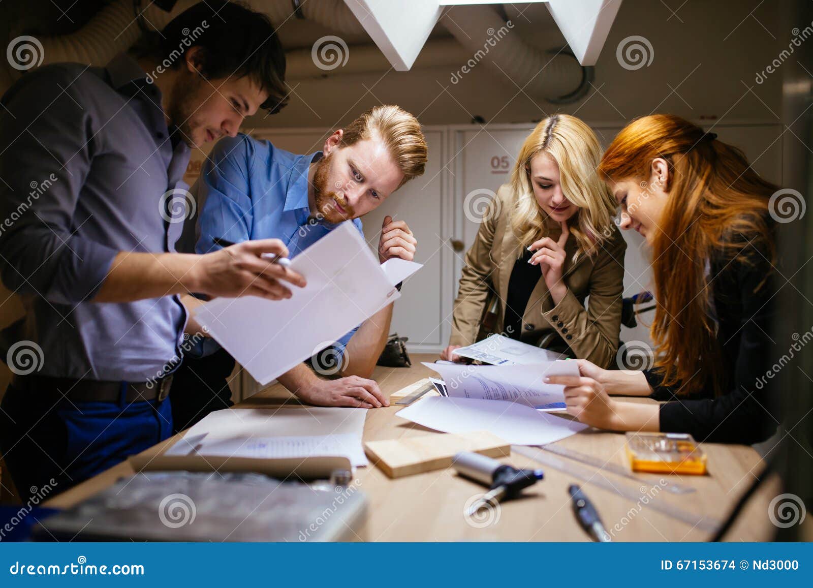 Classmates Working on a Project Together Stock Photo - Image of ...