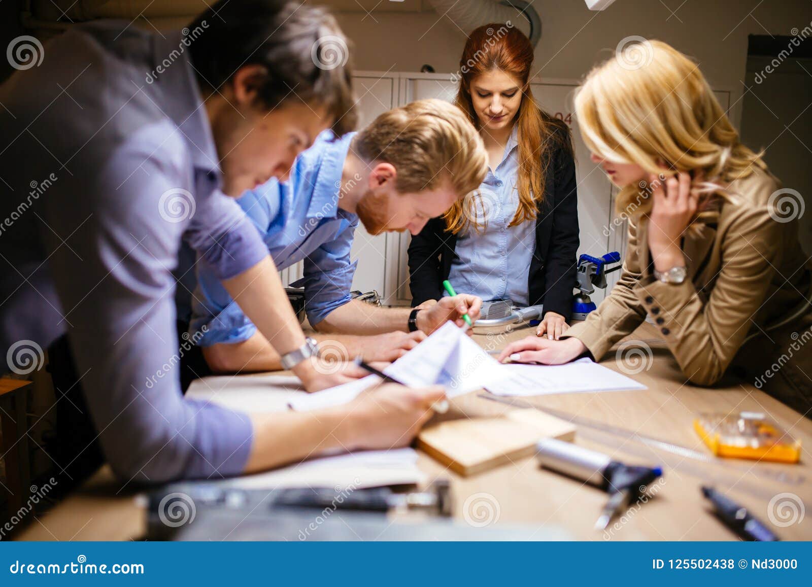 Classmates Working on a Project Together Stock Photo - Image of ...