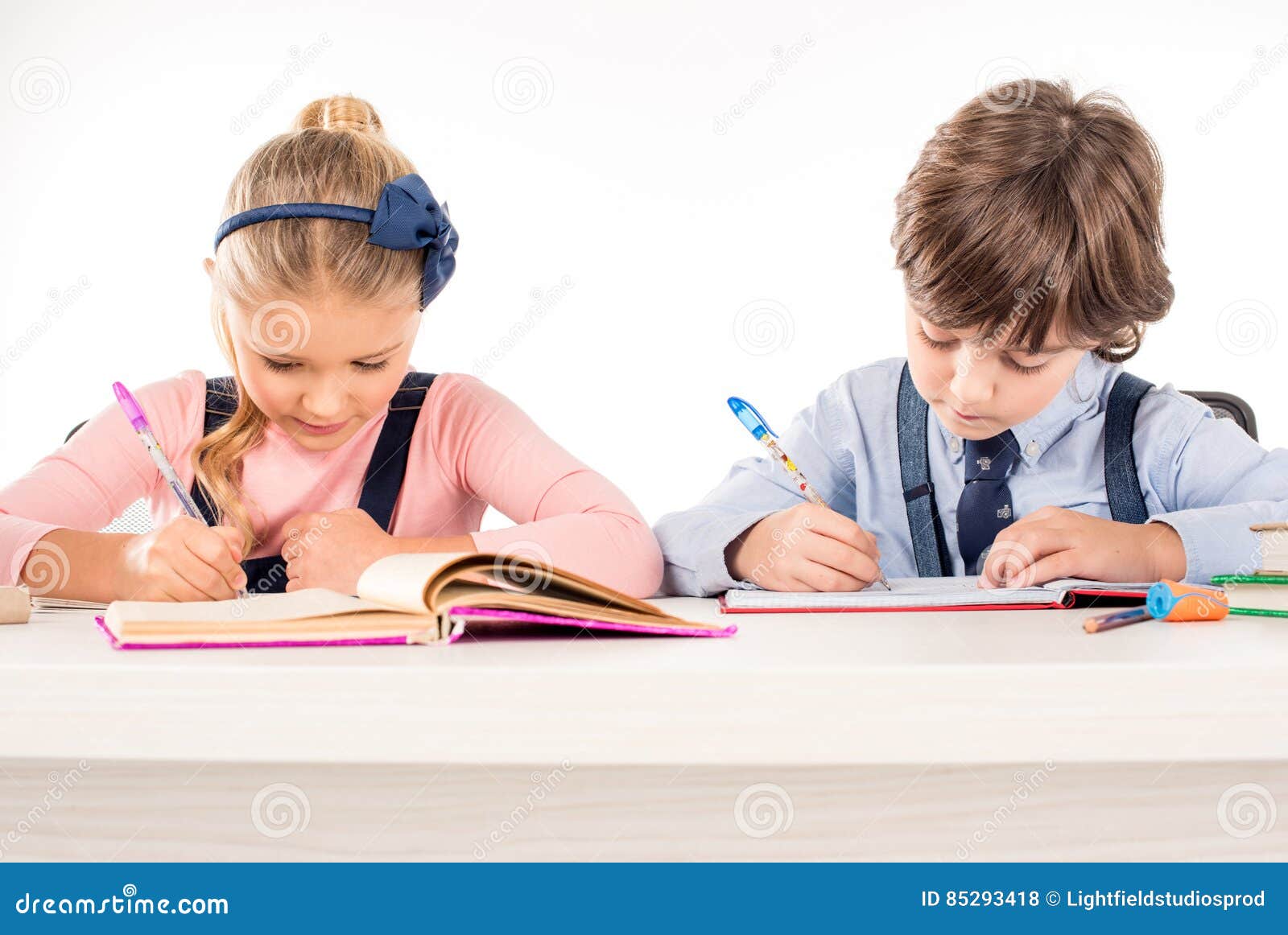 Classmates Writing Homework in Notebooks Stock Photo - Image of ...