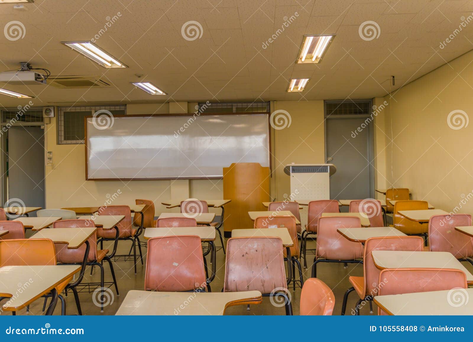 Classroom with Empty Desks with Large Whiteboard Stock Photo - Image of ...