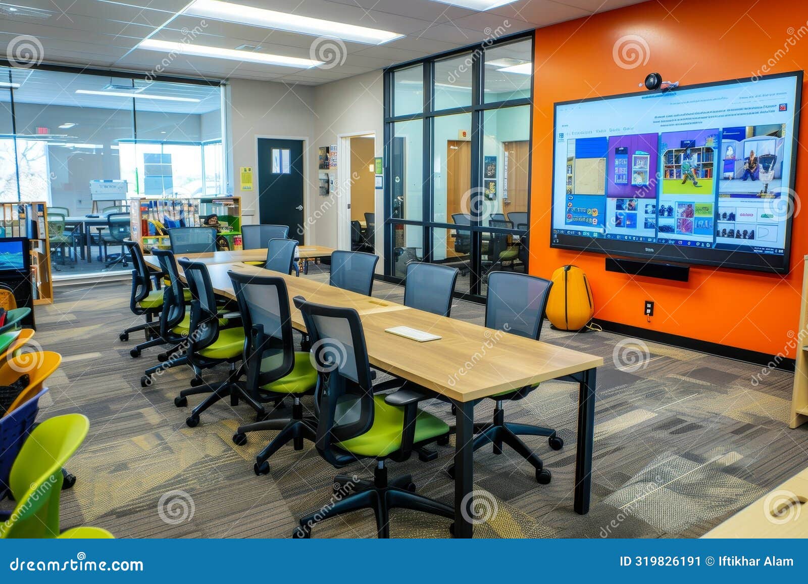 A Classroom Featuring a Large Screen for Presentations and Rows of ...