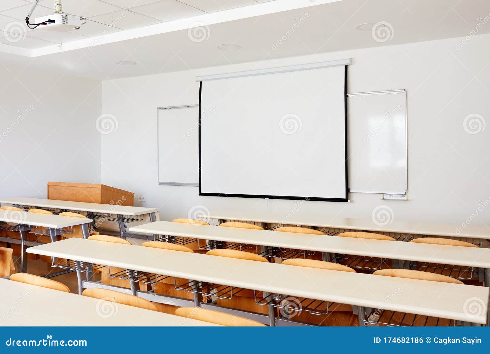 Classroom Interior with Projection Screen, White Board and Wooden Desks ...