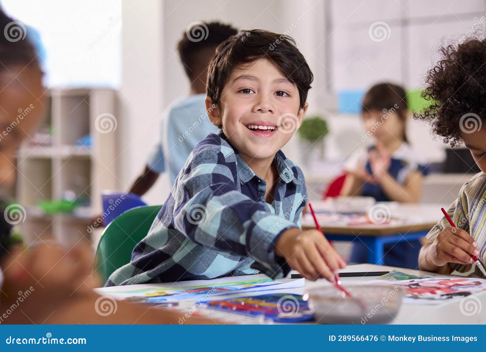 Classroom Portrait of Smiling Male Elementary School Pupil in Art Class ...