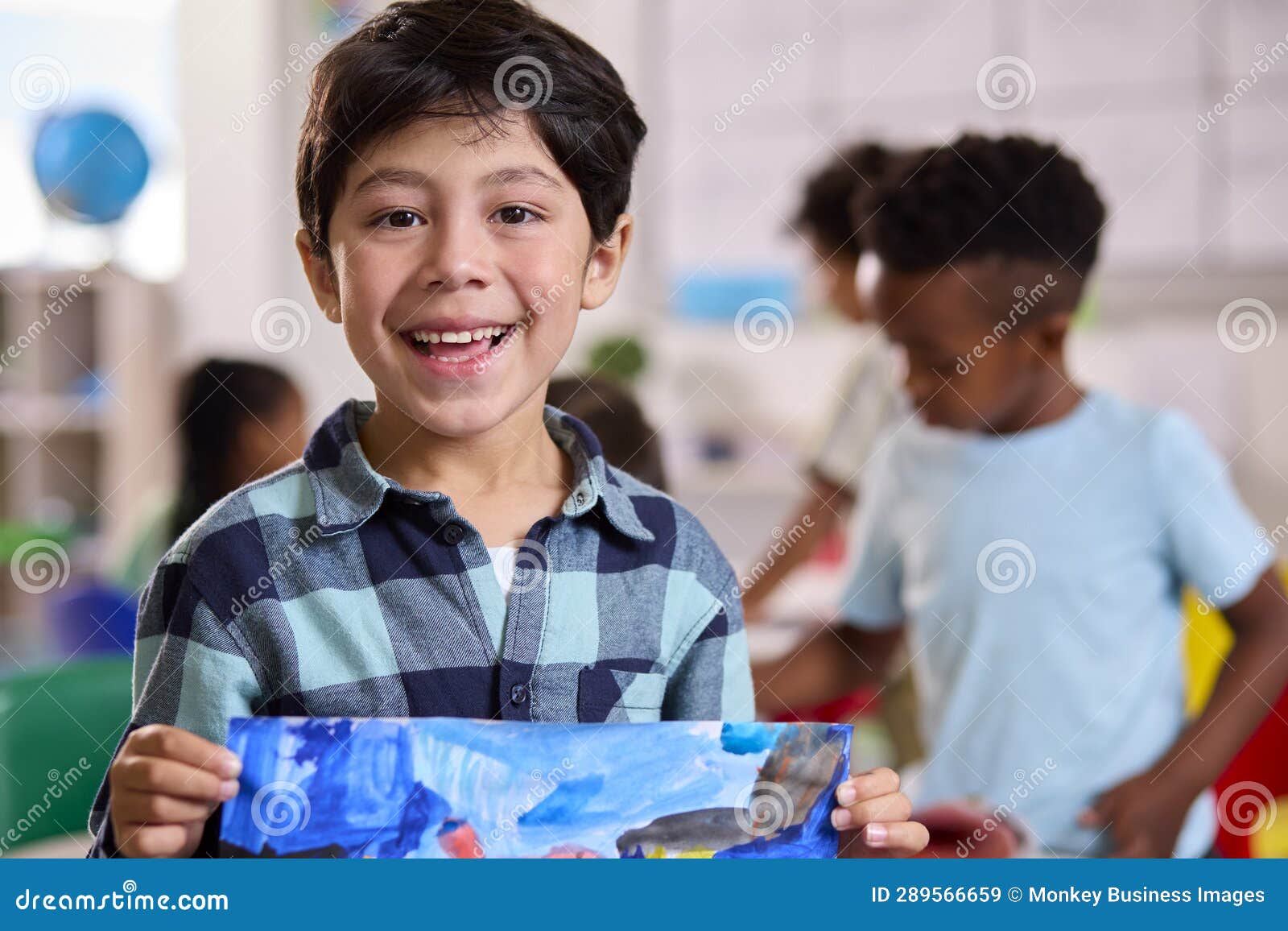 Classroom Portrait of Smiling Male Elementary School Pupil in Art Class ...