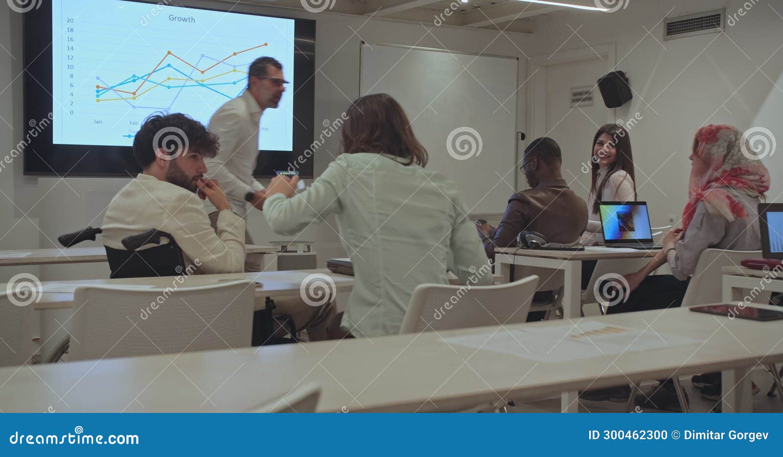 In a Classroom Setting, a Close-up View Captures a Diverse Group of ...