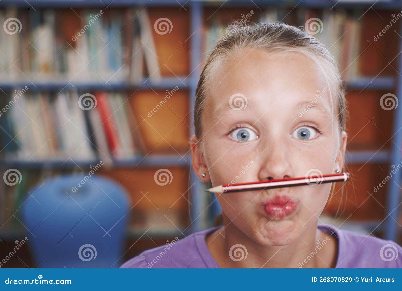 Classroom Shenanigans. a Cute Young Girl Balancing Her Pencil on Her ...