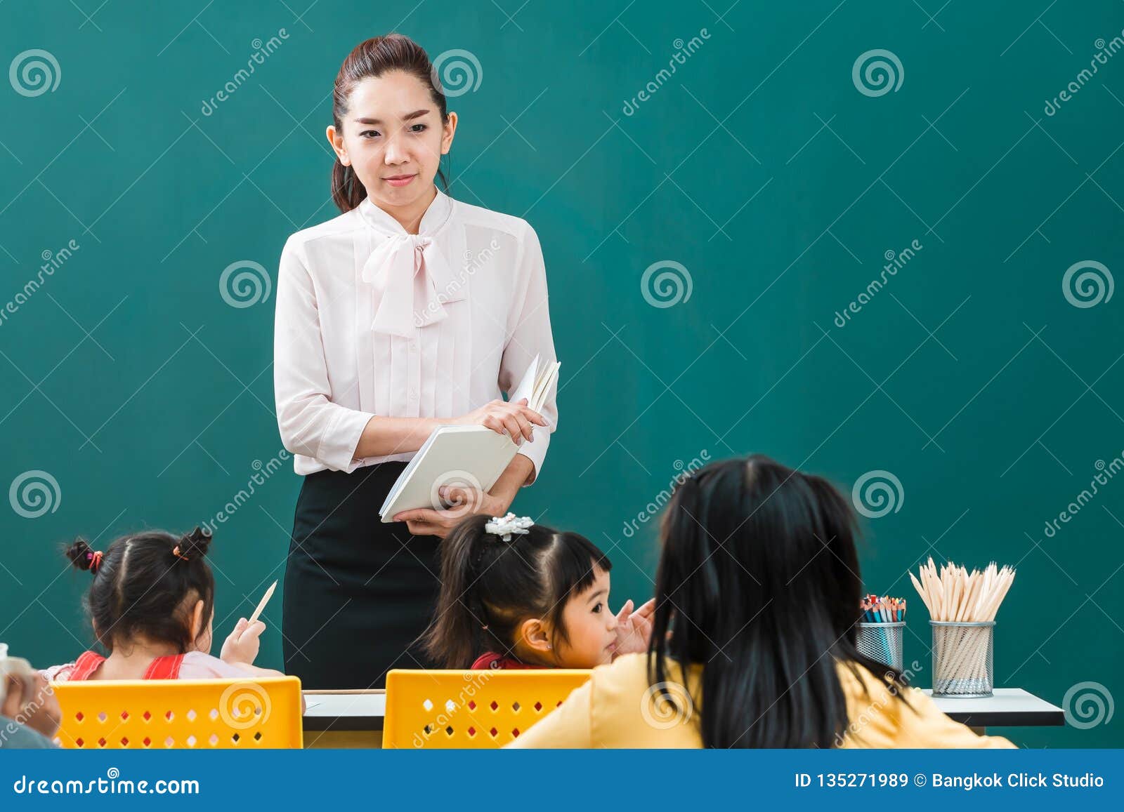 In Classroom, Students Do Their Exercise Stock Image - Image of adult ...