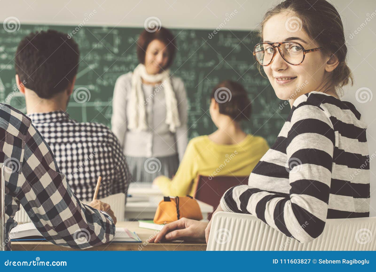 In Classroom with Students One of Them Look Behind Stock Image - Image ...