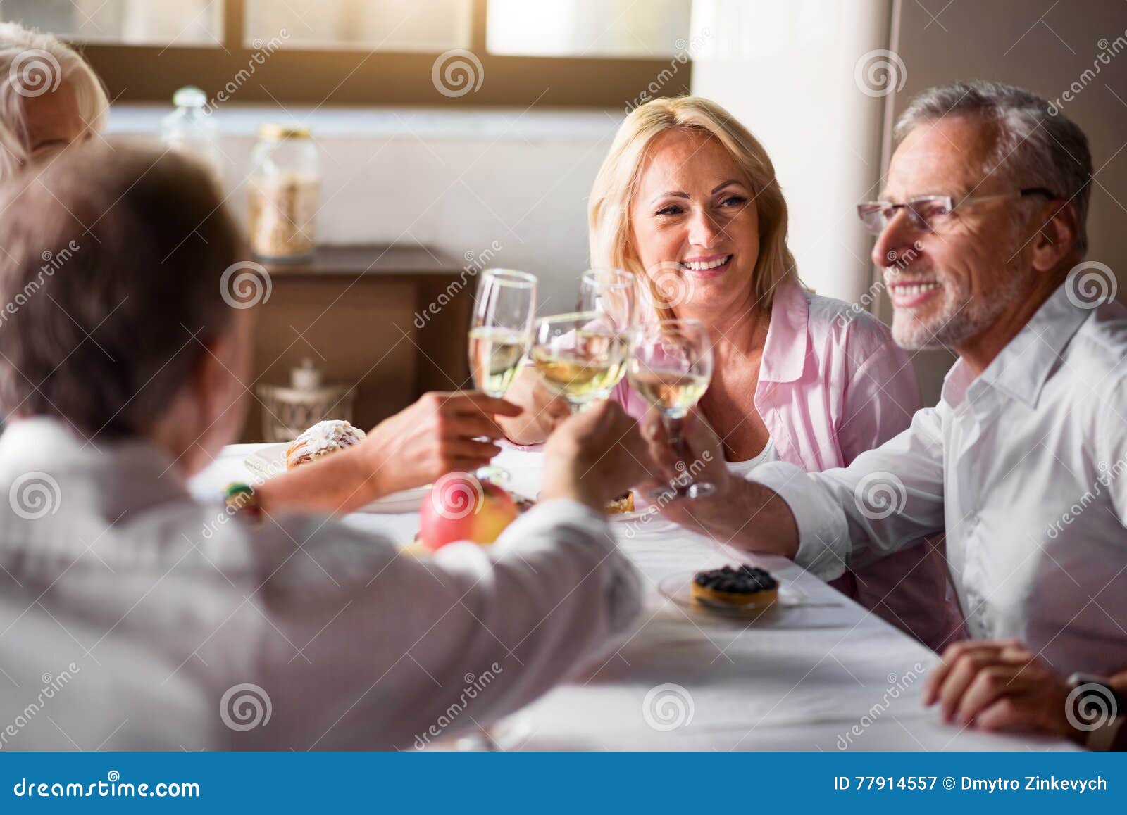 Classy Dressed Friends Having Drinks in the Kitchen Stock Image - Image ...