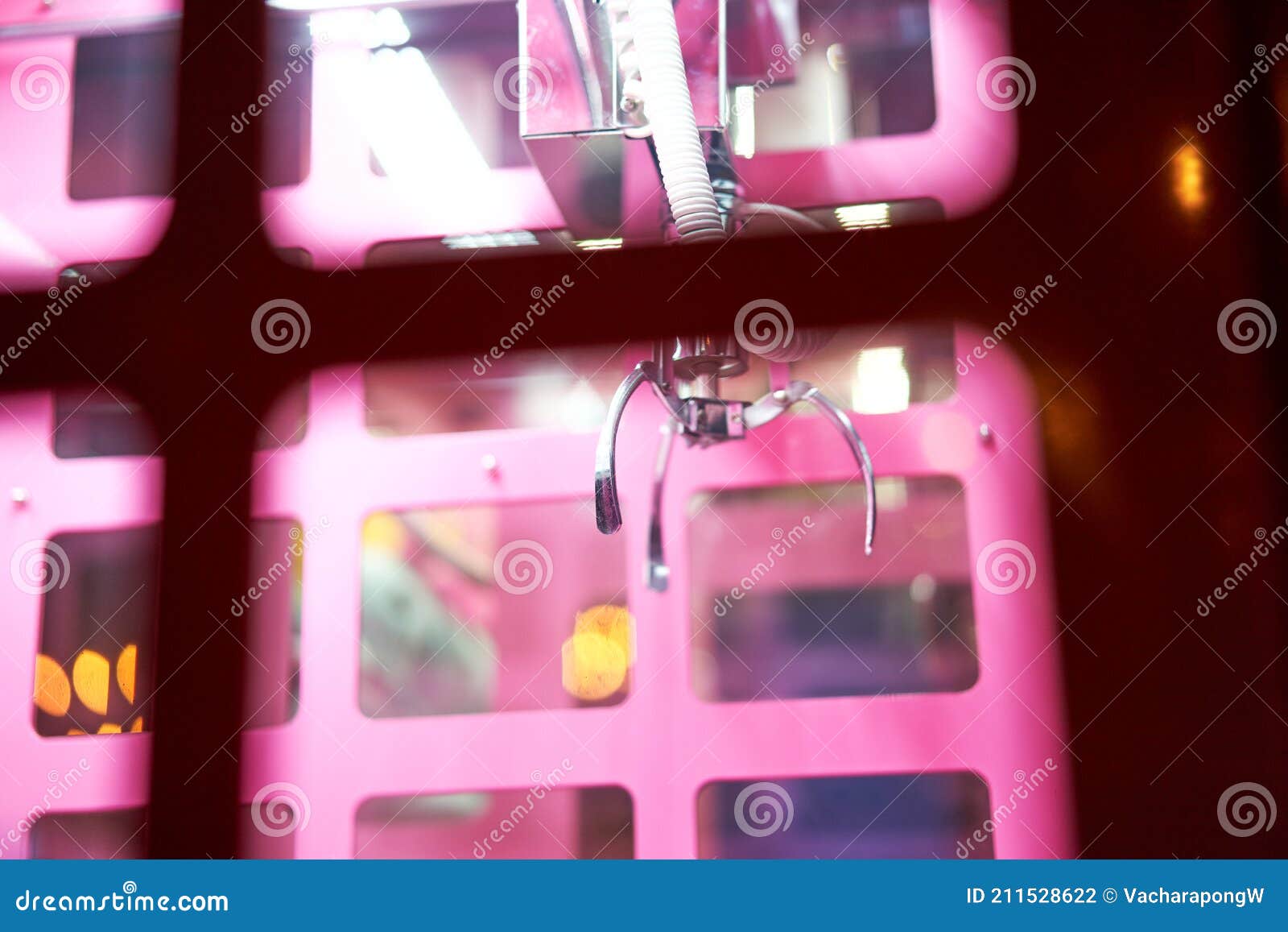 Claw Picker Doll Game Machine in Game Arcade Stock Photo - Image of ...