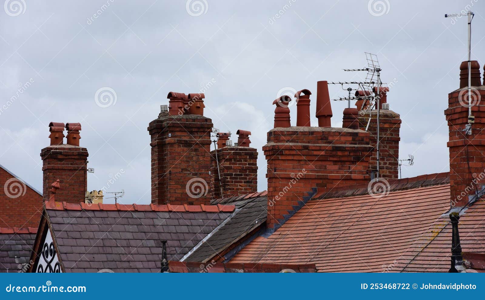 Clay Chimney Pots on Rooftops Stock Photo - Image of antennae, capped ...