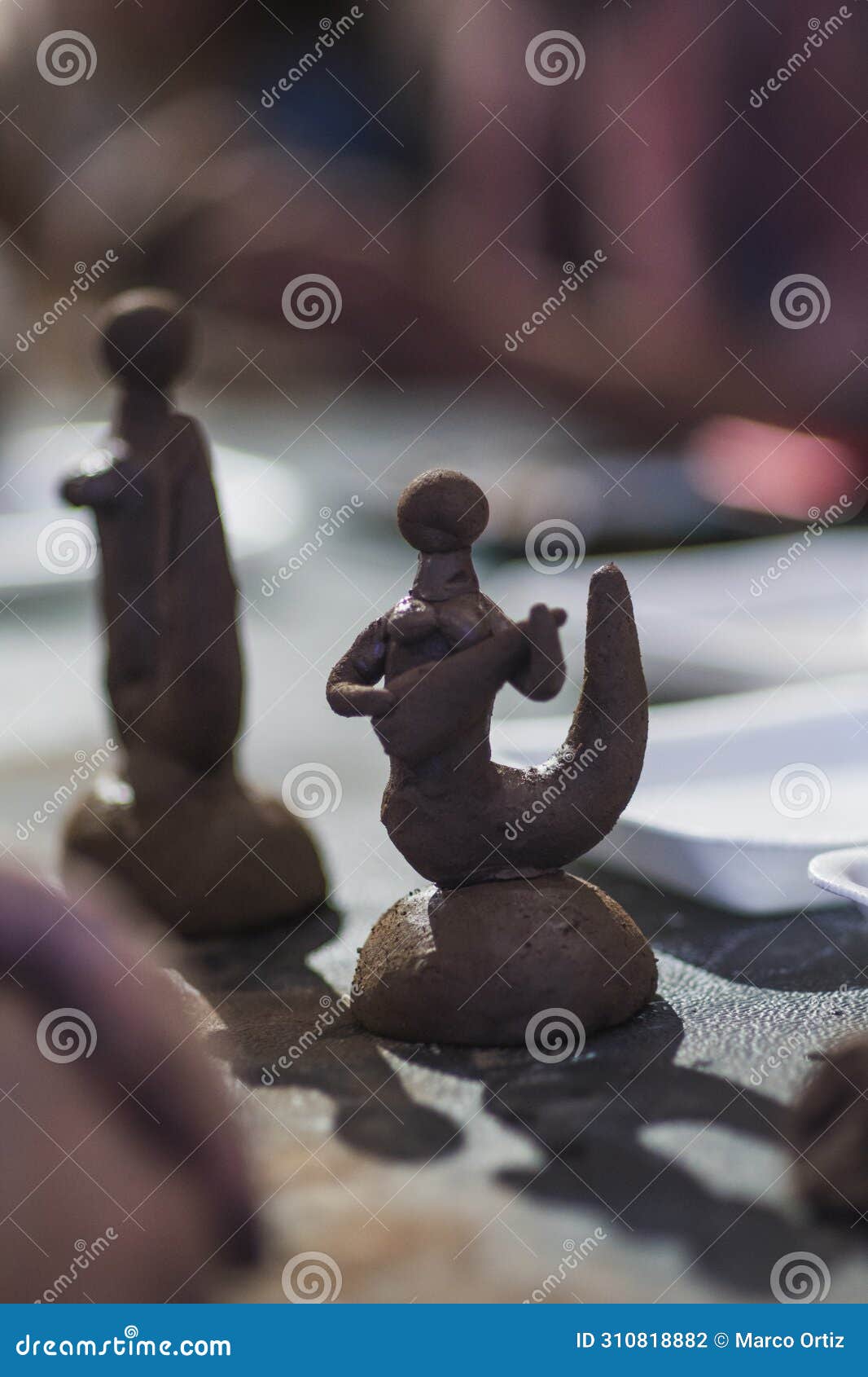 Clay Figures Being Molded To Create Mermaids Stock Photo - Image of ...