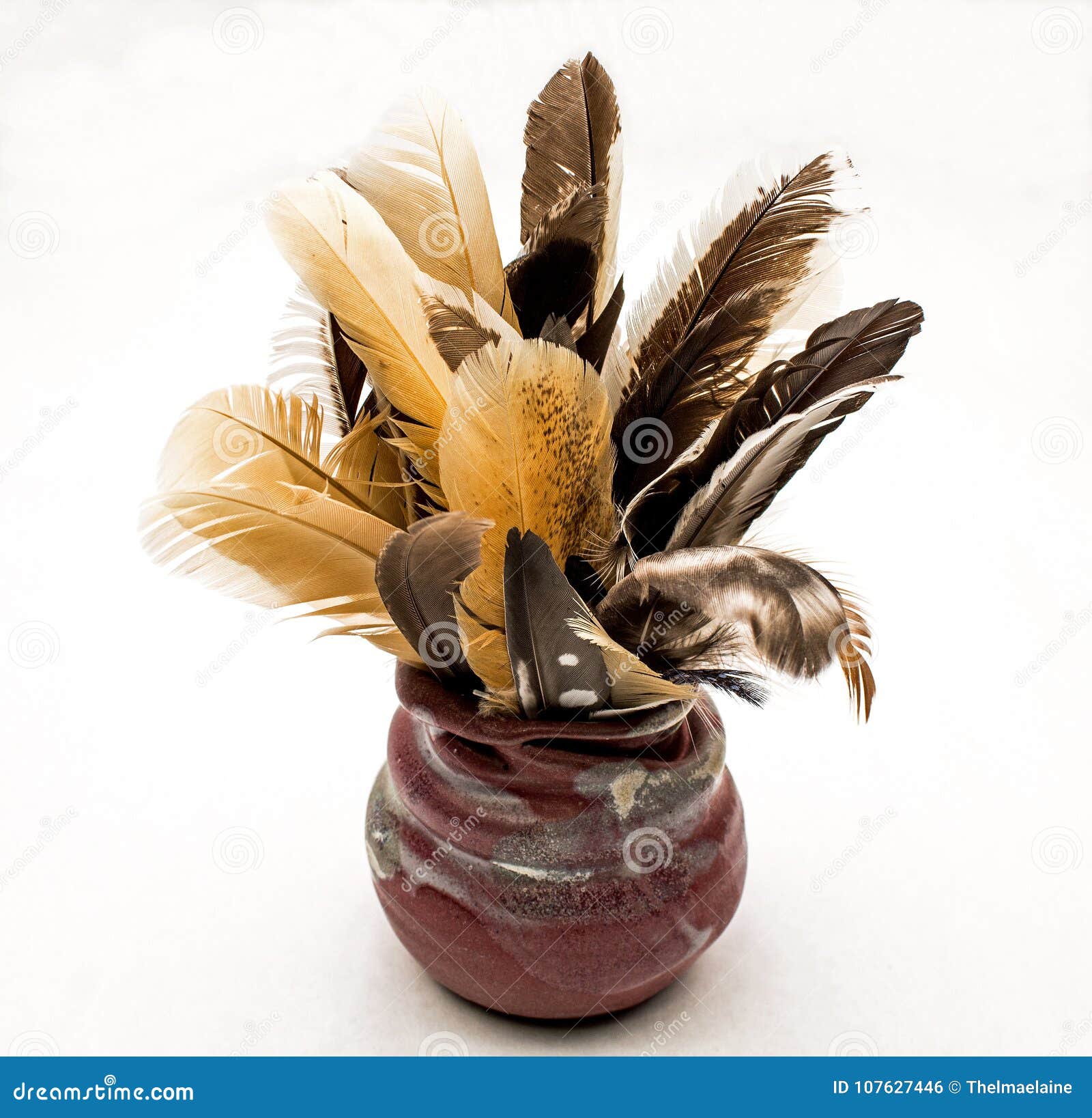 Clay Jar full of Feathers stock photo. Image of closeup - 107627446