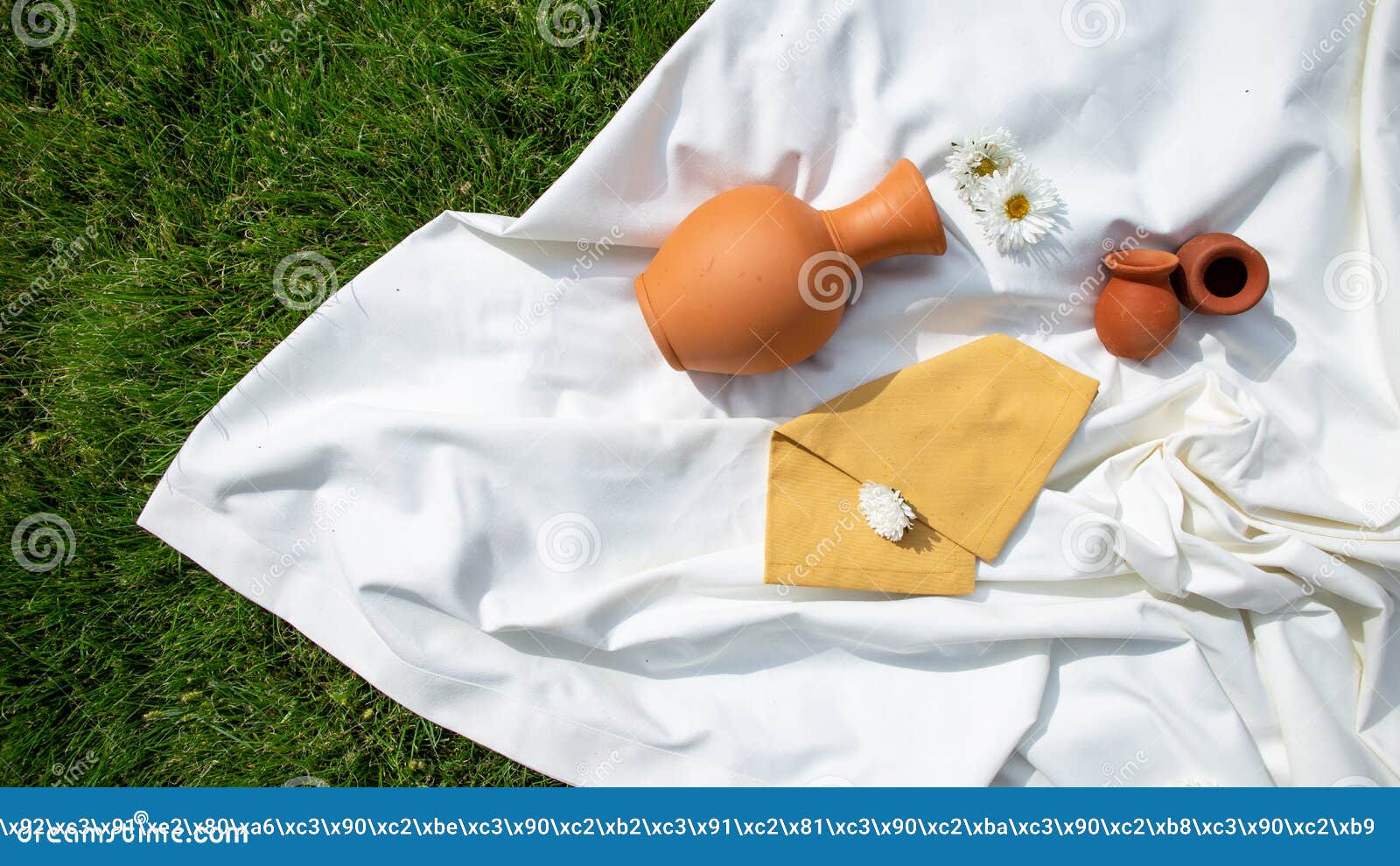A Clay Jug on a White Cloth on the Grass. Top View Stock Photo - Image ...