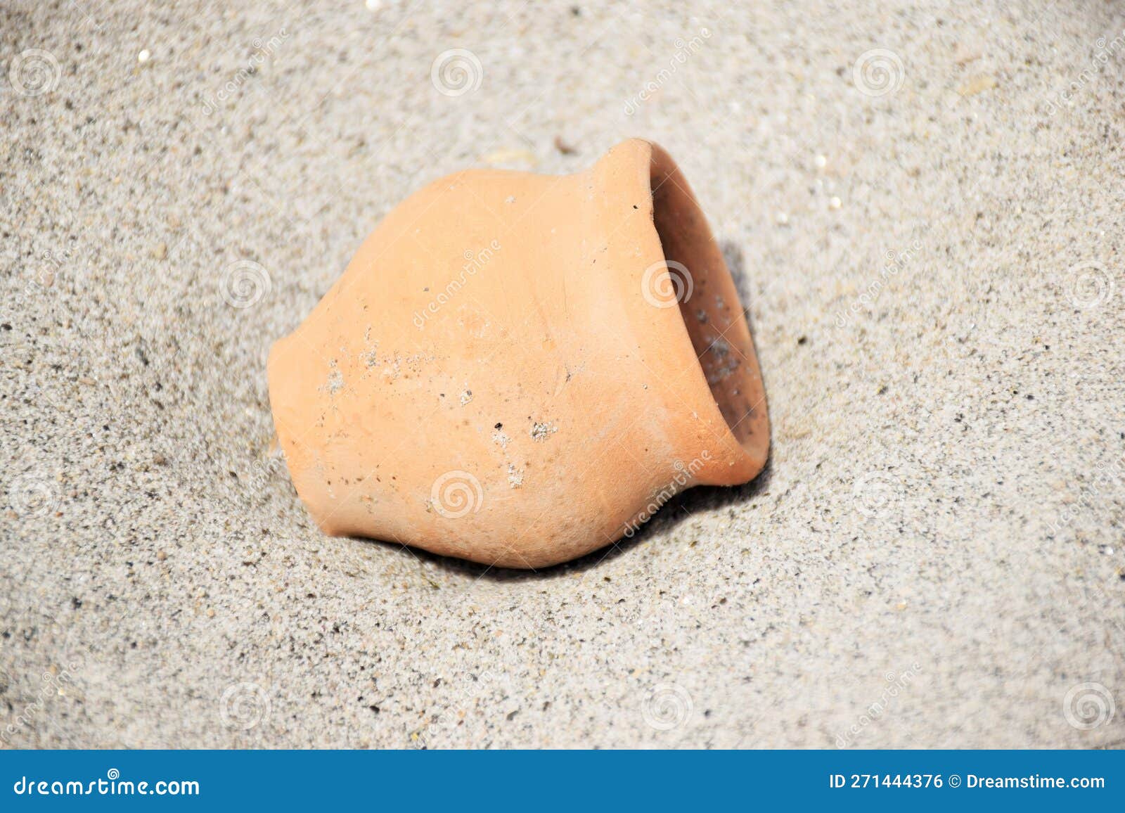 A Clay Pot Laying Down on the Sand Stock Photo - Image of rock, snack ...