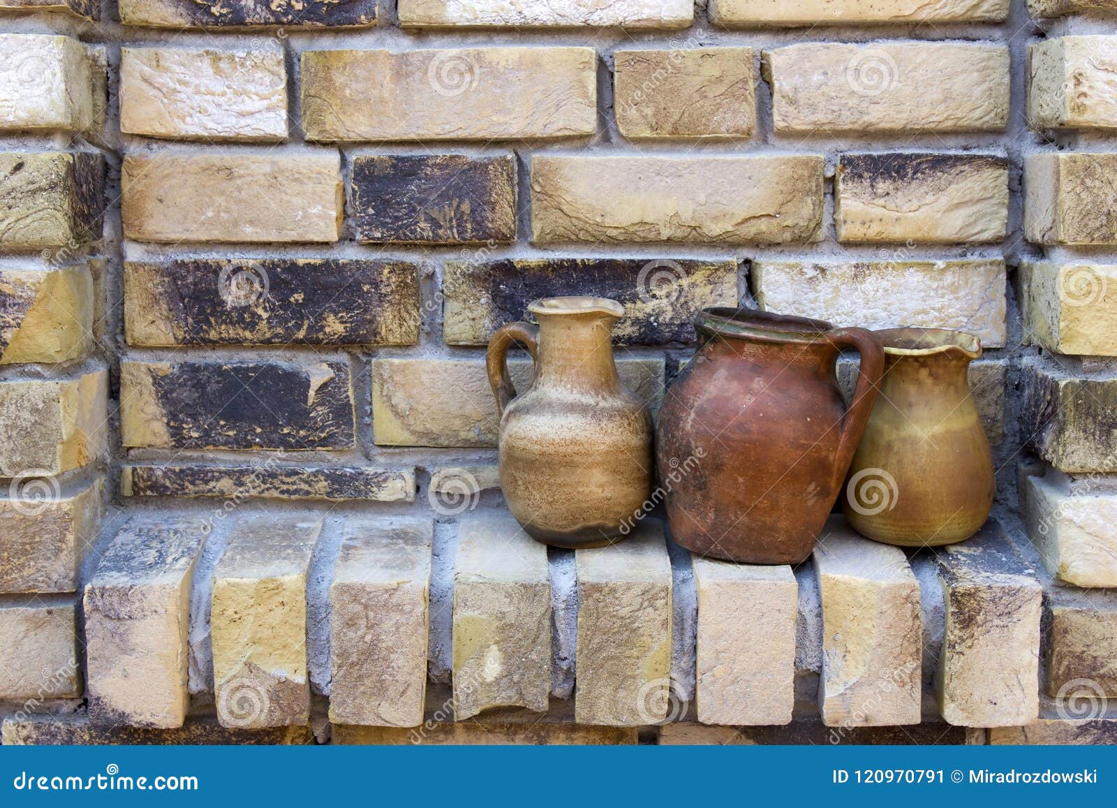 Clay pots on a brick wall stock image. Image of ancient - 120970791
