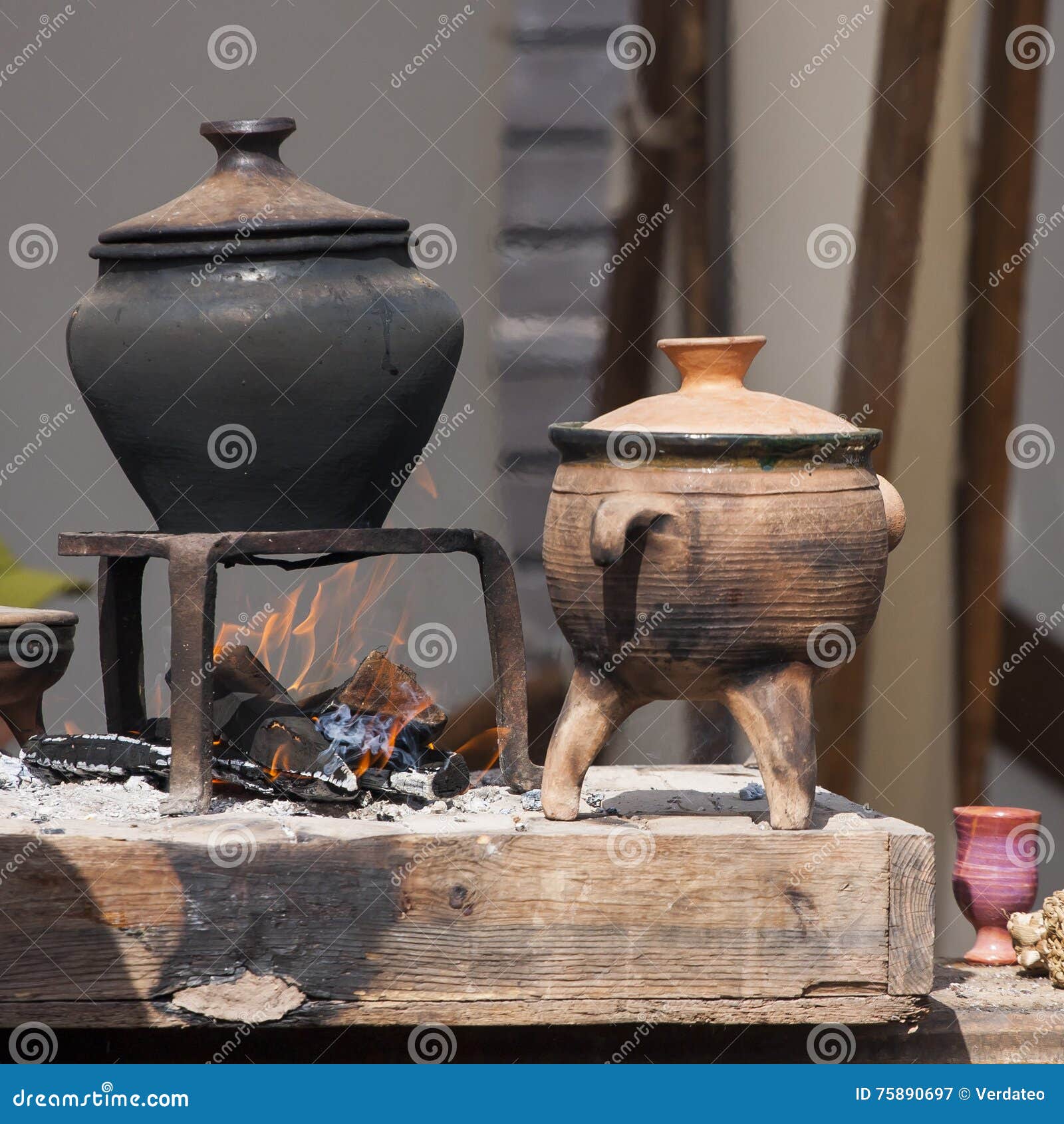Clay pots on fire stock image. Image of stone, warm, black - 75890697