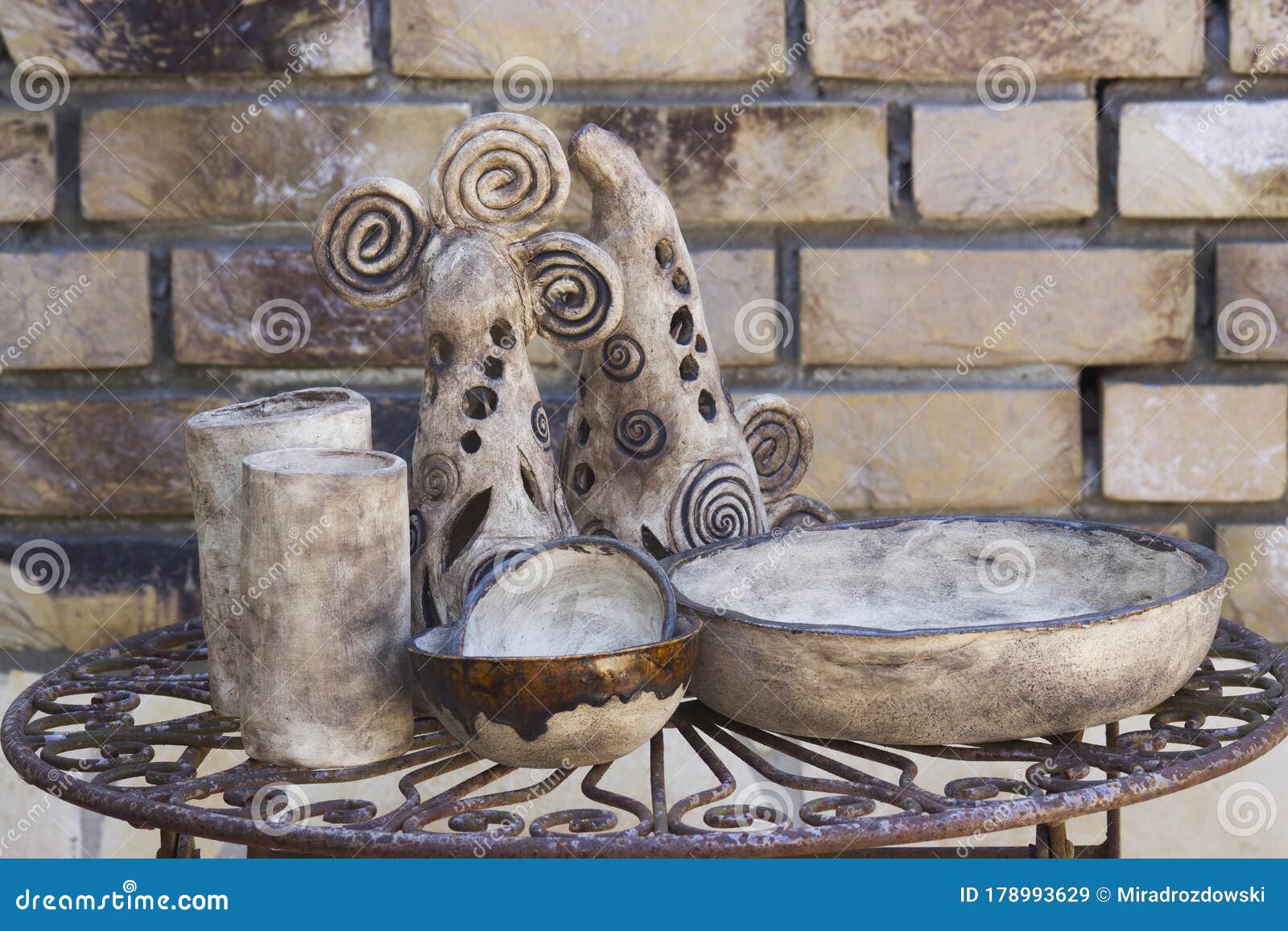 Clay pots on a metal table stock image. Image of closeup - 178993629