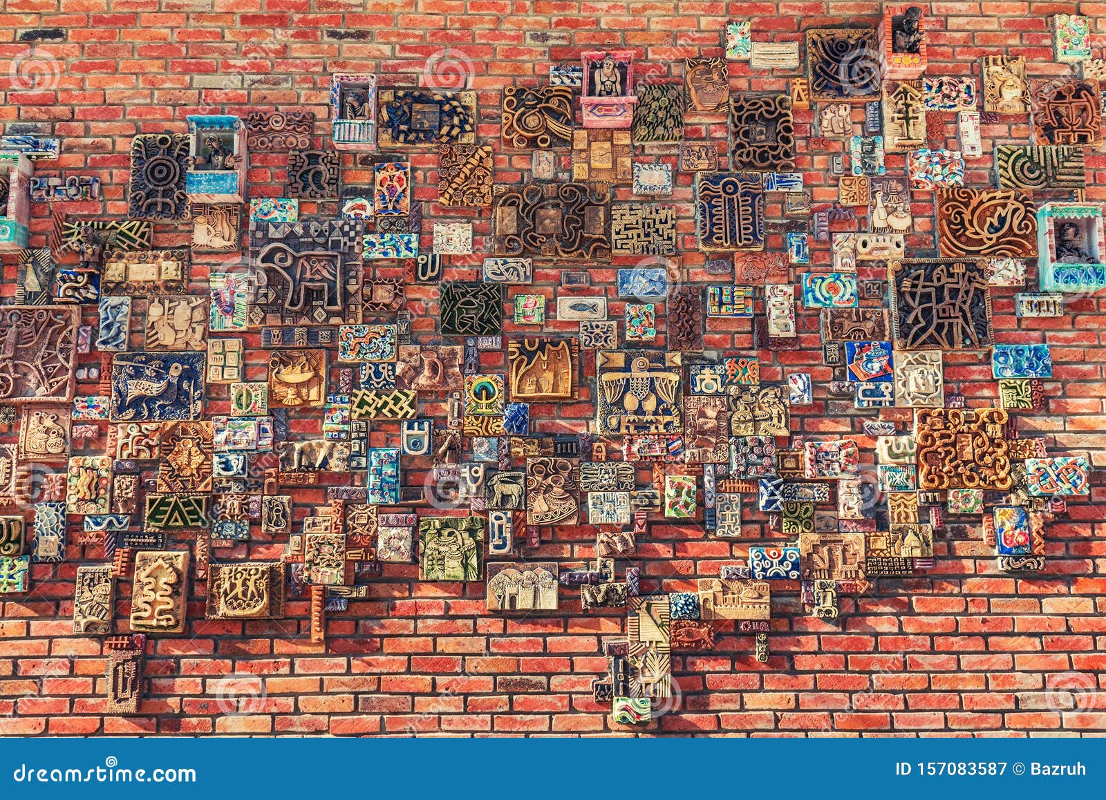Clay Relief Crafts on a Brick Wall Stock Image - Image of wall, motif ...