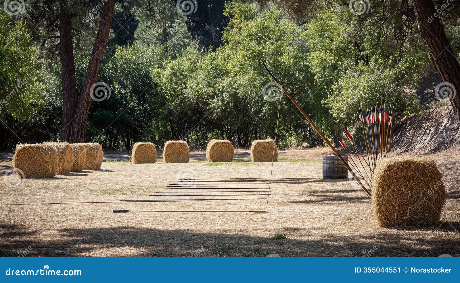 A Clean Archery Range with a Bow, Arrows, and Hay Bale Targets Stock ...