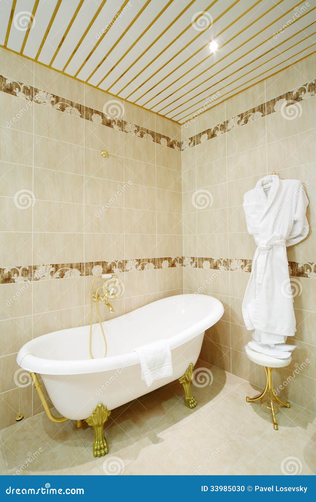Clean Bathroom with Bath and Bathrobe in Classic Style. Stock Photo ...