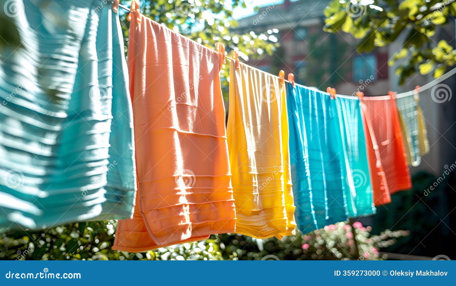 Clean Clothes Hanging on Washing Line Outdoors. Drying Laundry Stock ...