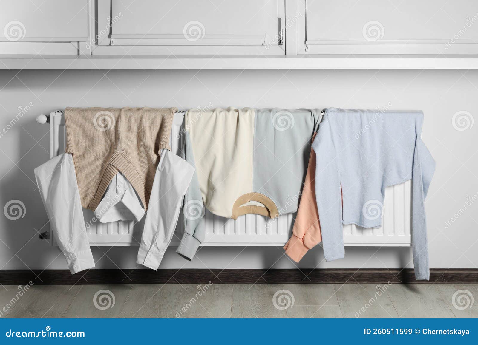 Clean Clothes Hanging on White Radiator in Room Stock Image - Image of ...