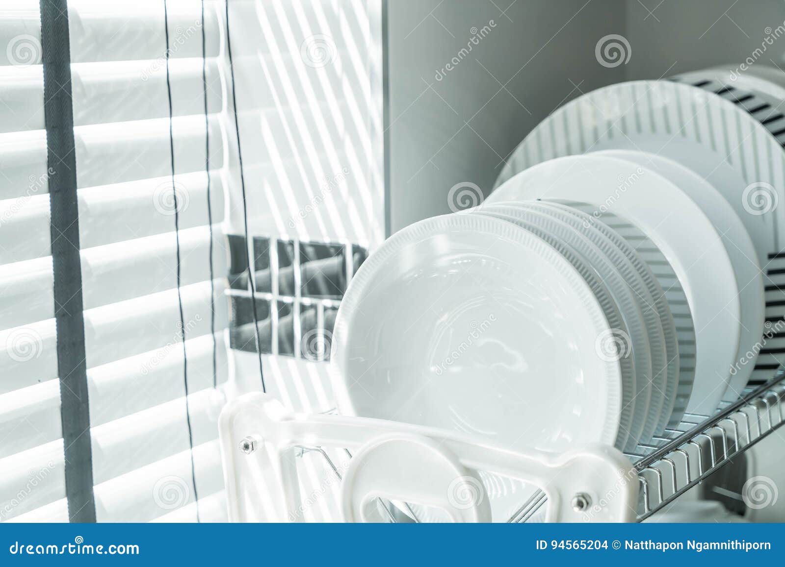 Clean dish on a dish rack stock photo. Image of tableware - 94565204