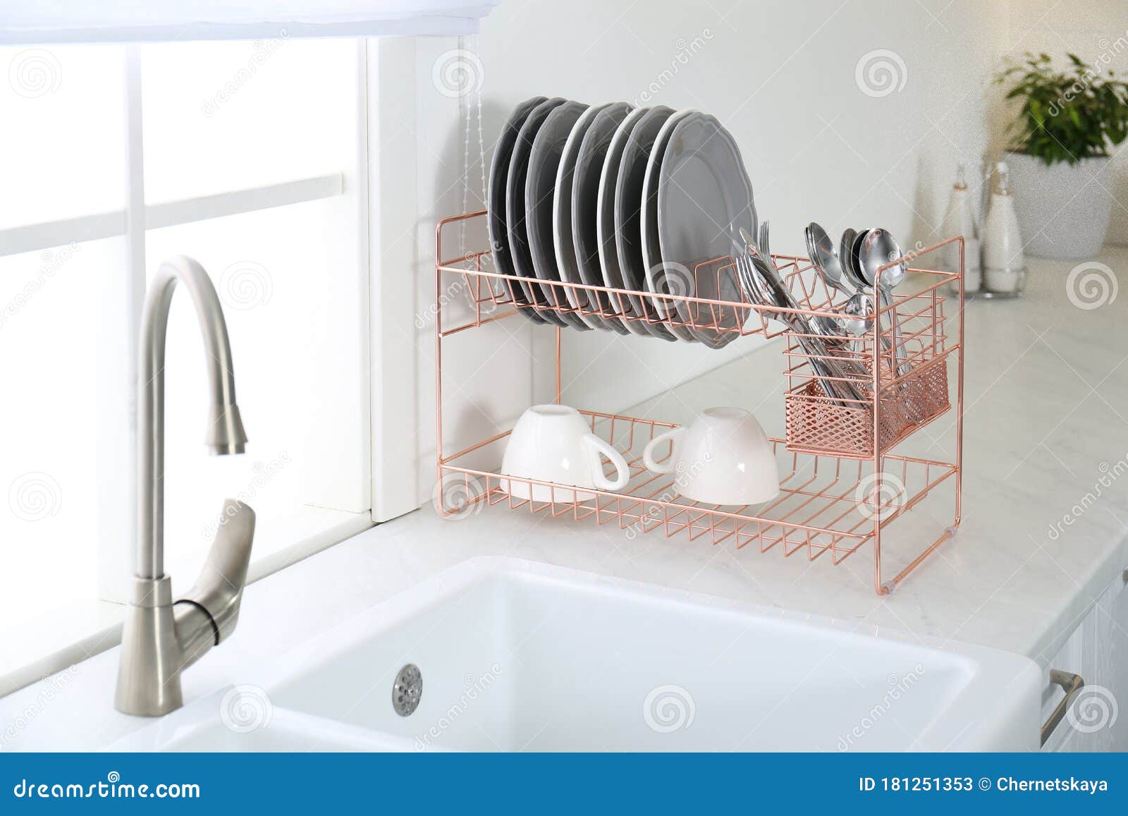 Clean Dishes on Drying Rack in Modern Kitchen Stock Image - Image of ...
