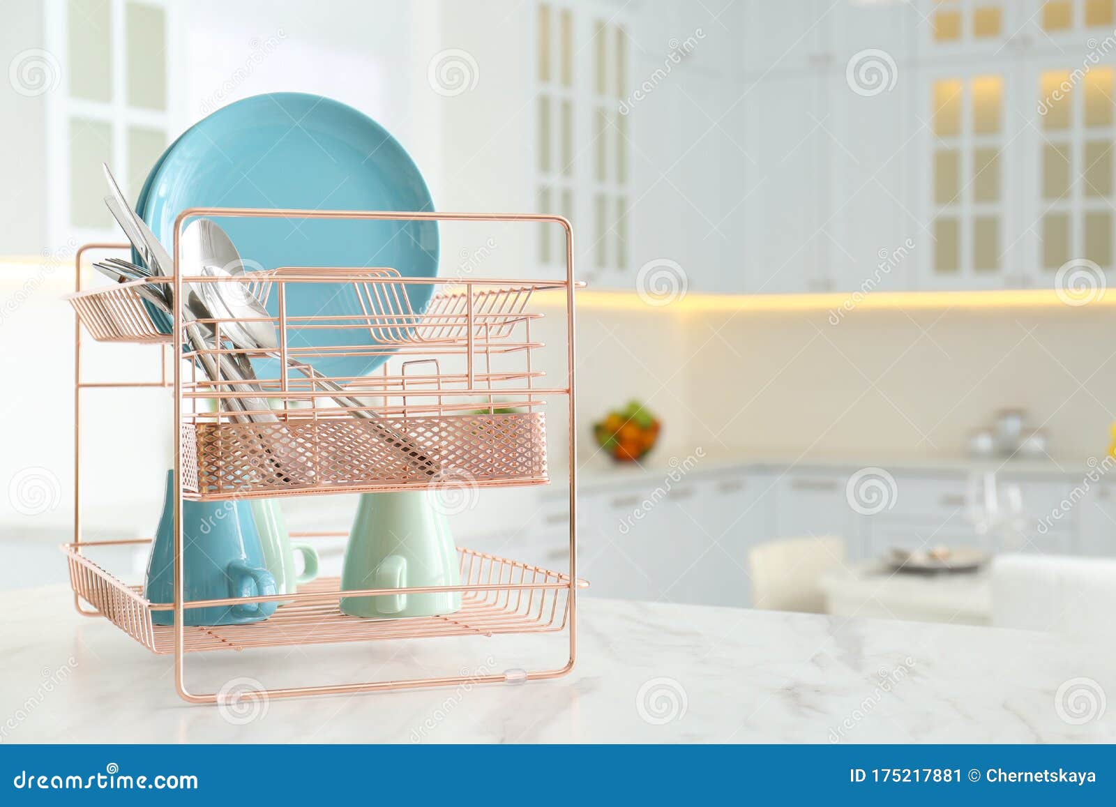 Clean Dishes on Drying Rack in Modern Kitchen Interior, Space for Text ...