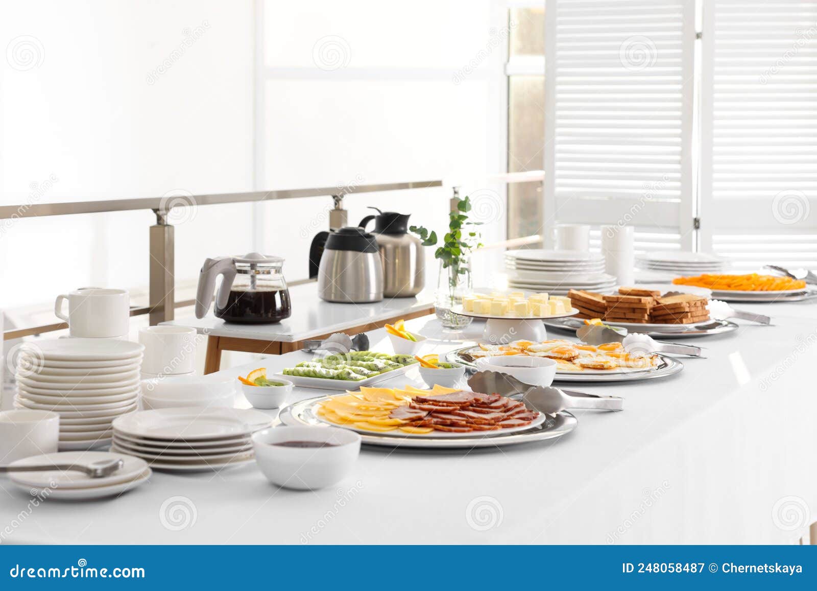 Clean Dishware and Different Meals for Breakfast on White Table Indoors ...