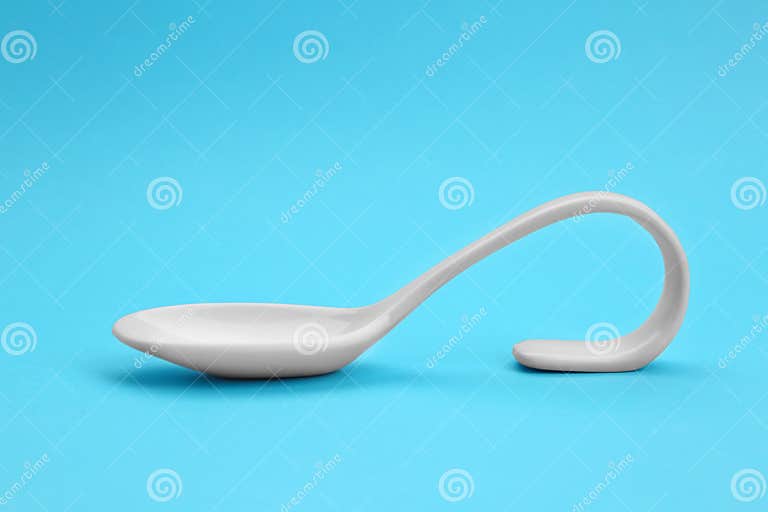 Clean Empty Ceramic Appetizer Spoon on Blue Stock Image - Image of ...