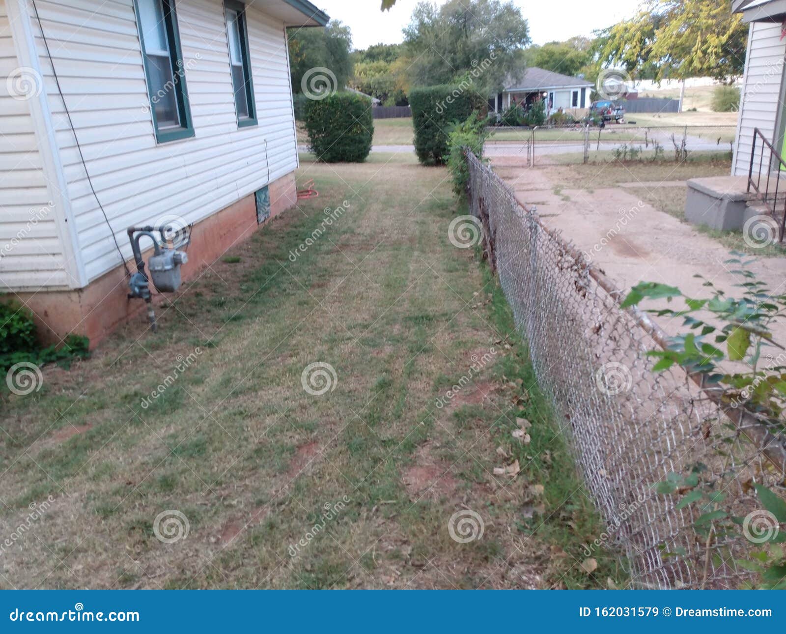 Clean freshly raked yard. stock image. Image of yard - 162031579