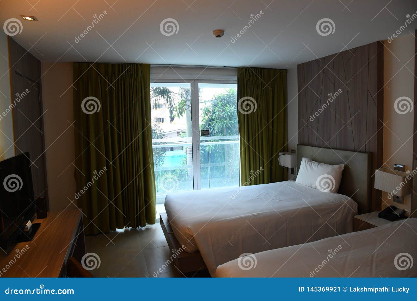 Clean hotel room stock image. Image of bedroom, lamp - 145369921