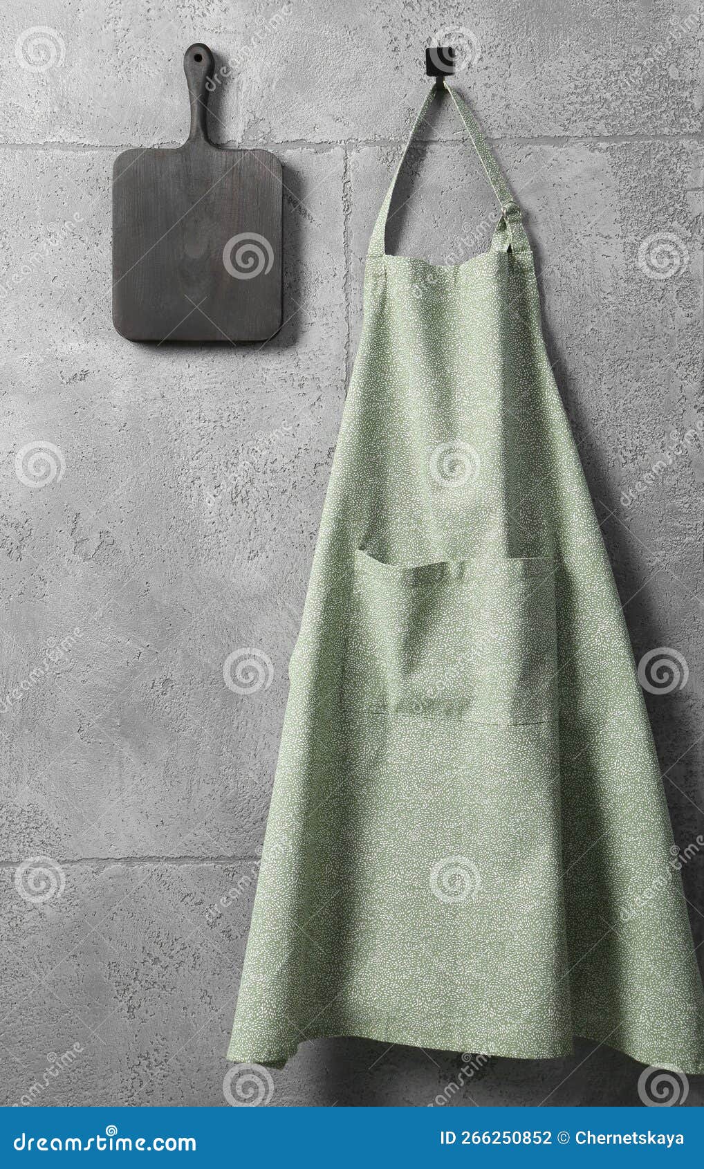 Clean Kitchen Apron with Pattern and Board on Grey Tiled Wall Stock ...