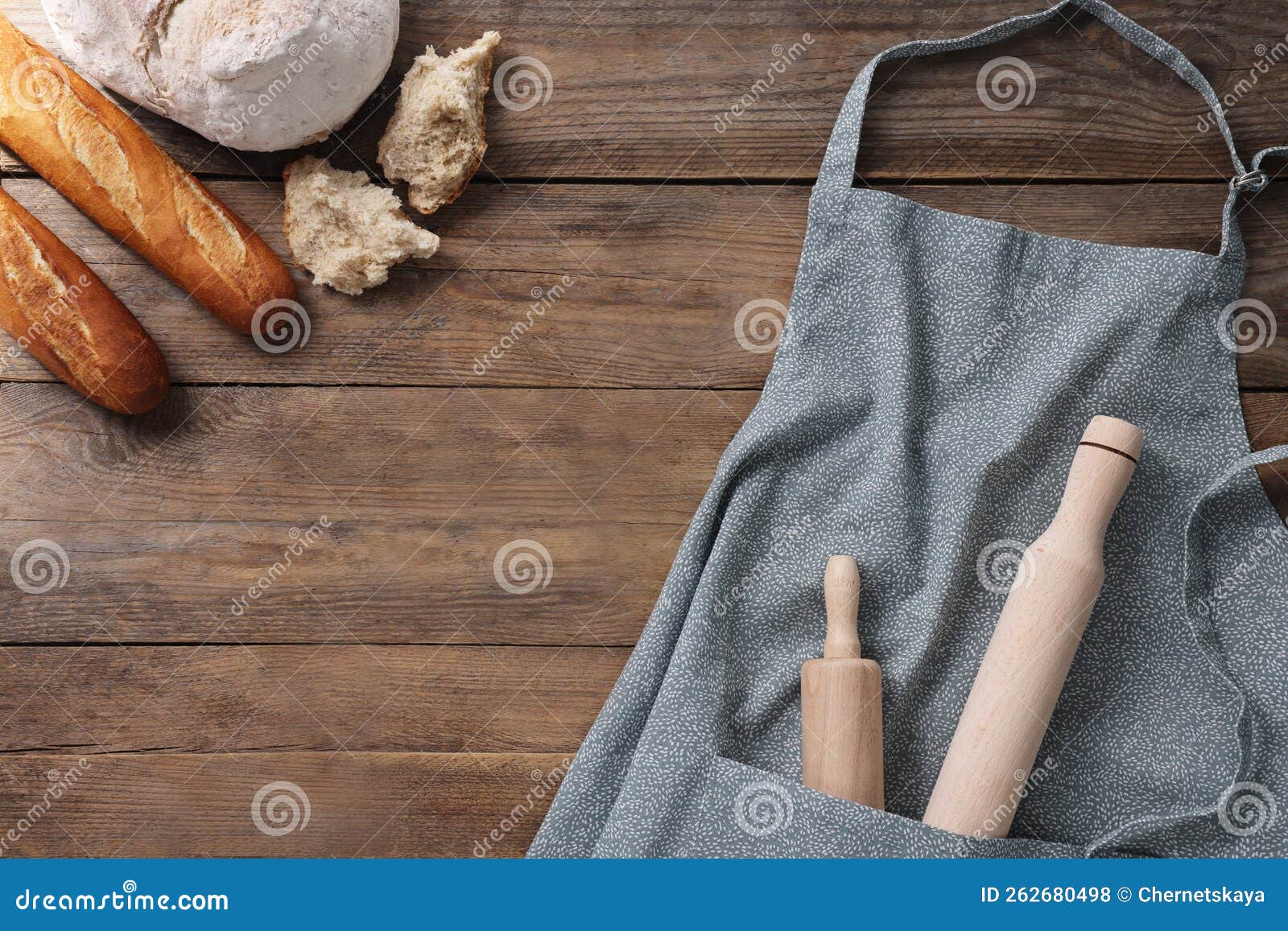 Clean Kitchen Apron with Rolling Pins and Different Types of Bread on ...