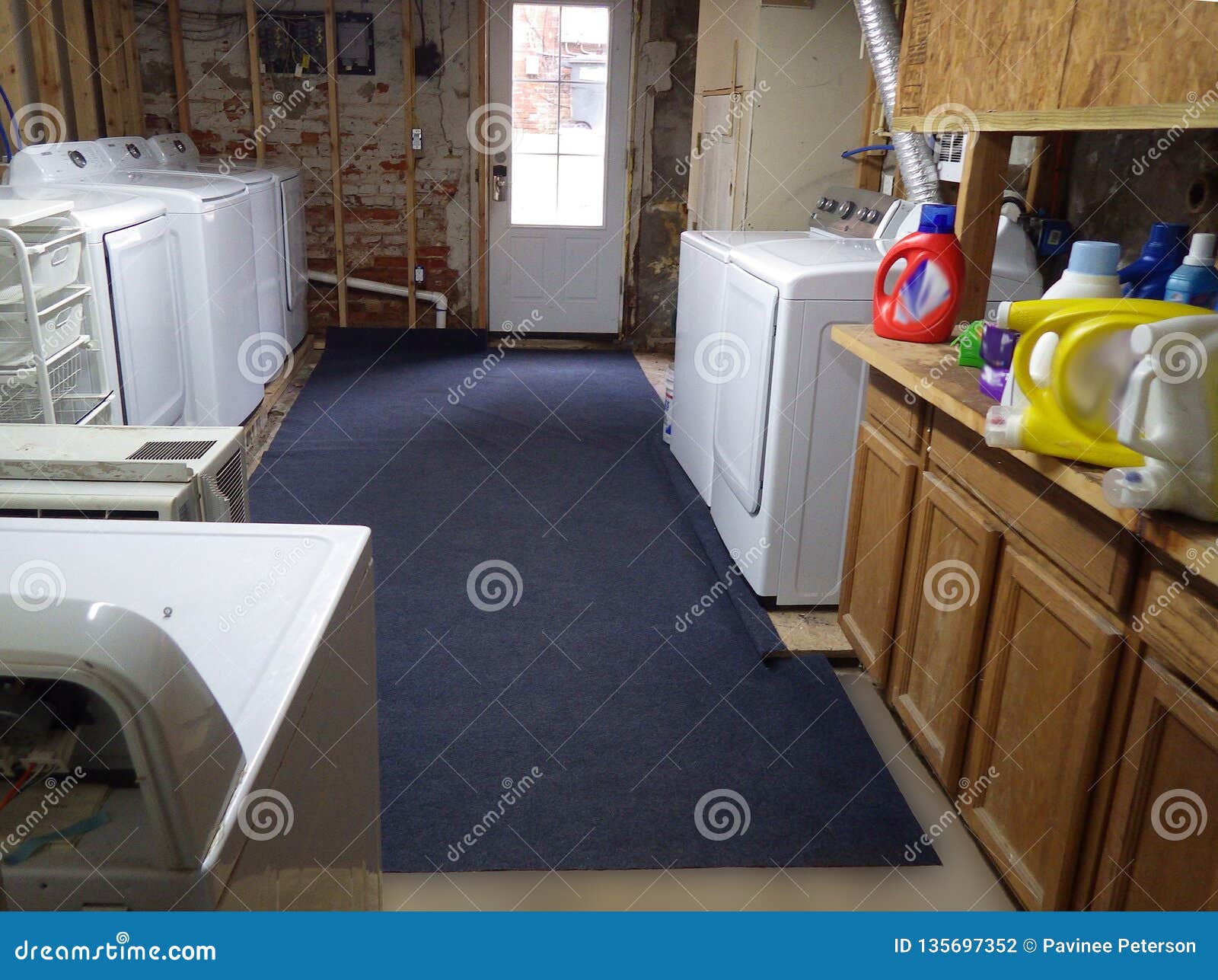 Clean laundry room stock photo. Image of home, hotel - 135697352
