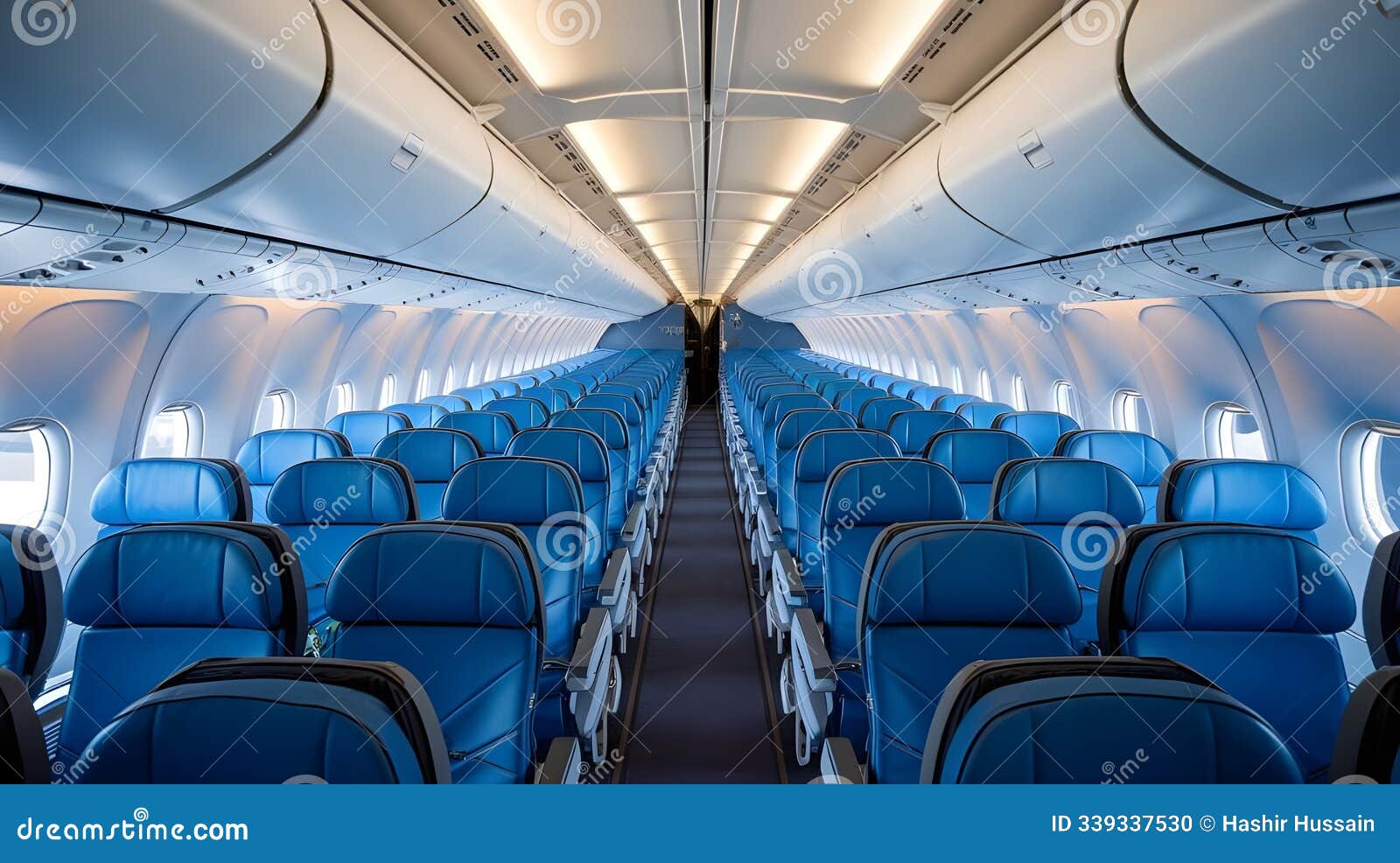 Empty Airplane Cabin Interior with Blue Seats and Overhead Compartments ...