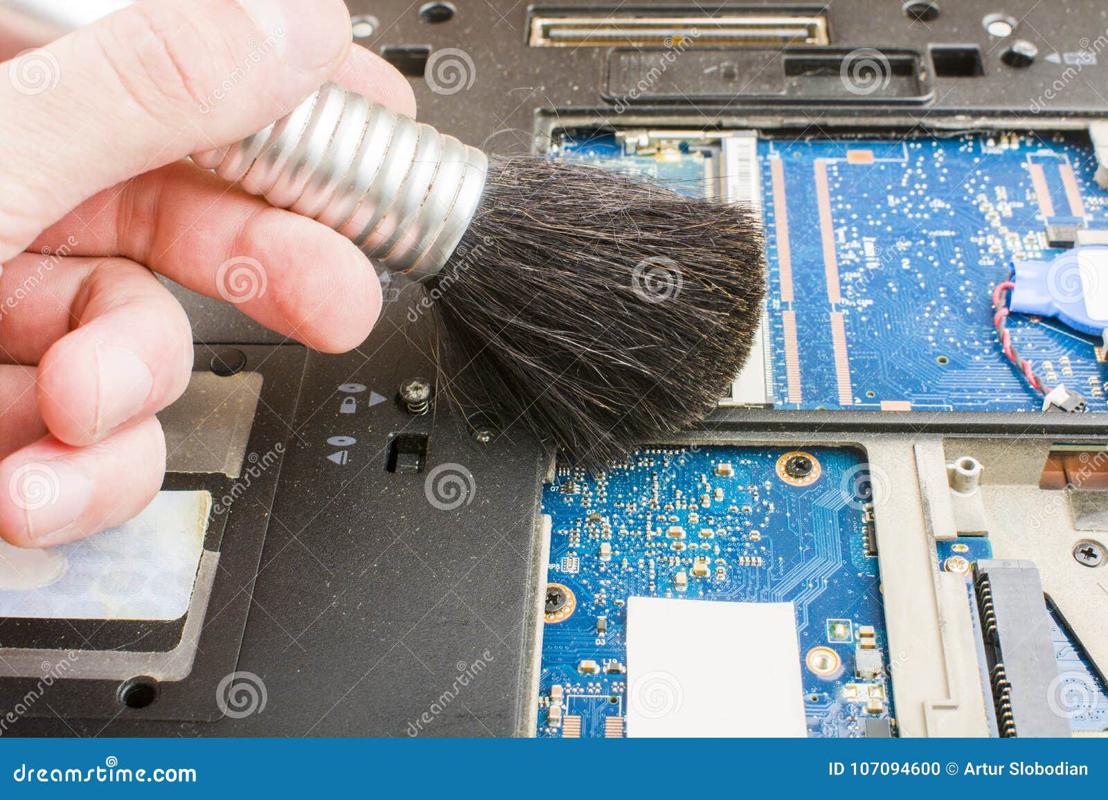 Clean the Notebook System from Dust and Dirt with a Brush during ...