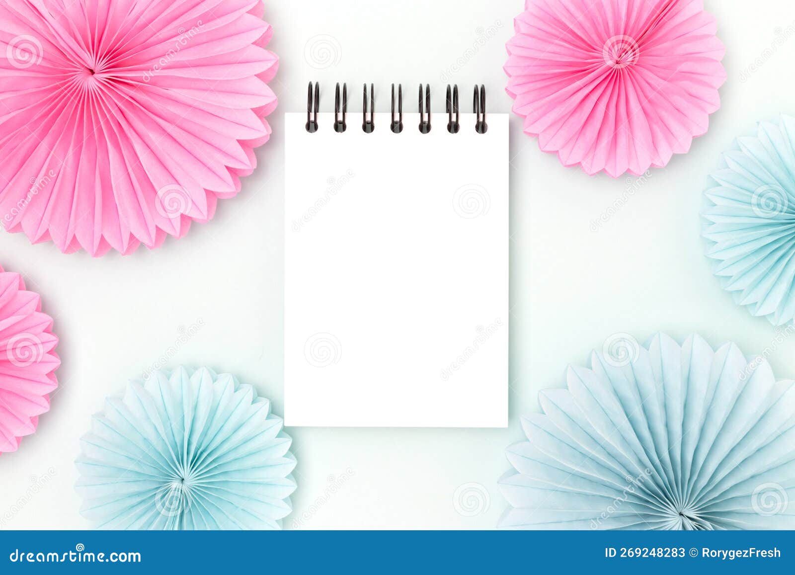 Clean Notepad Mockup and Tissue Paper Fans on a Blue Background. Stock ...