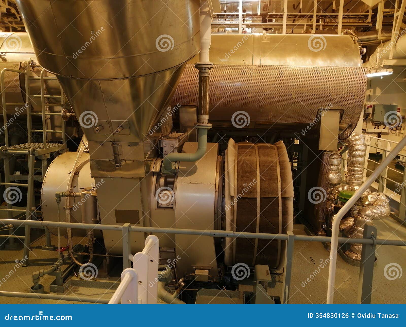 Industrial Engine Room with Cylindrical Machinery and Pipes Stock Photo ...