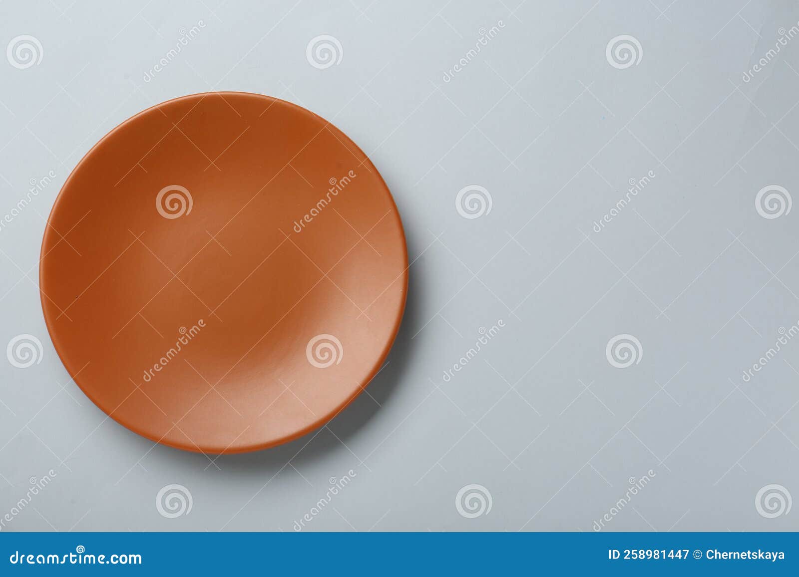 Clean Orange Plate on Light Grey Background, Top View. Space for Text ...
